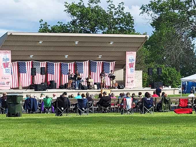 The Karas Memorial Bandshell hosts summer concerts where lawn chairs become temporary real estate and American flags provide the perfect backdrop for community harmony.