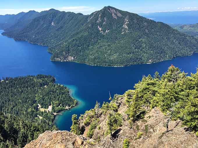 The view from Storm King Mountain reveals just how impossibly blue this glacial masterpiece truly is from above.