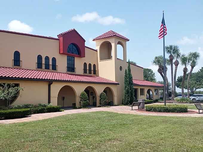The Mediterranean-style building with palm trees flanking the entrance perfectly captures Florida's ability to be both tropical and sophisticated simultaneously.