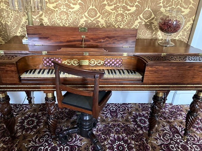 This antique piano sits ready for someone to play Chopin, though you'd probably need white gloves first.