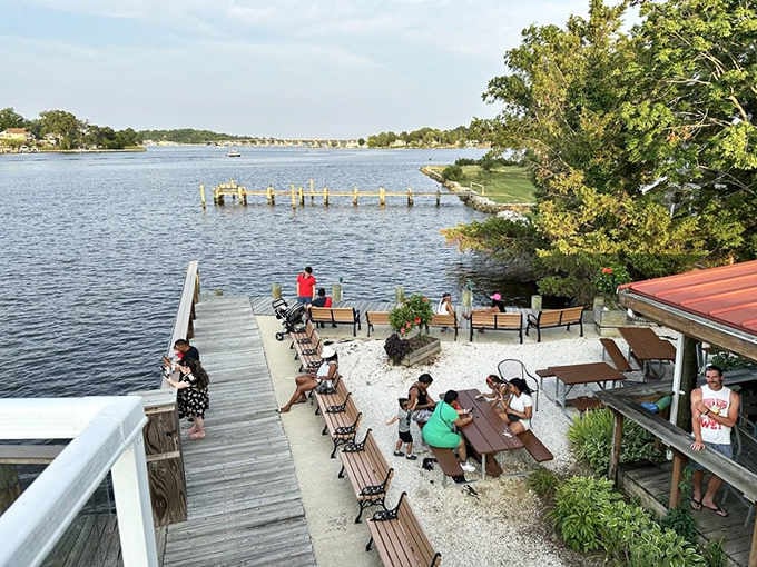 Outdoor seating on crushed shells with river breezes, because Maryland summers demand this exact setting always.
