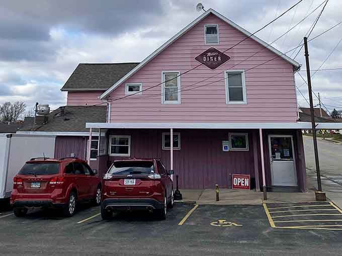 That parking lot tells the story: locals know this pink building holds something special worth the drive.