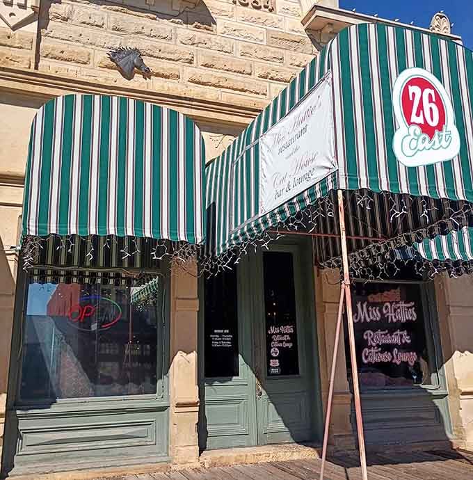Those green and white awnings beckon from the street, promising an experience that's anything but your average Tuesday dinner.