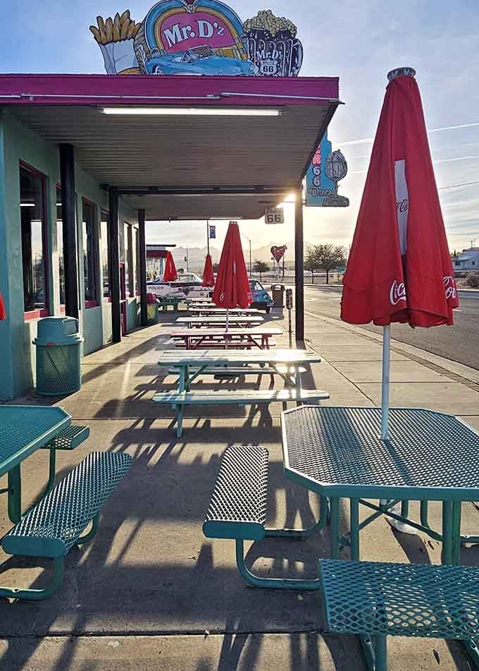 Outdoor picnic tables in matching turquoise wait patiently for weather-perfect days and Instagram-worthy photo opportunities galore.