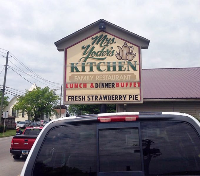 Fresh strawberry pie advertised on the sign means someone inside understands what really matters in life today.