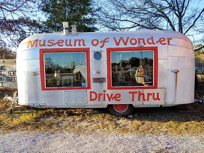 That vintage camper trailer has been transformed into the world's most charming ticket booth and welcoming committee rolled into one.