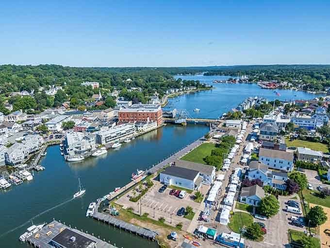 This breathtaking aerial view reveals Mystic's perfect marriage of land and sea, with the iconic drawbridge connecting not just two shores, but past and present.