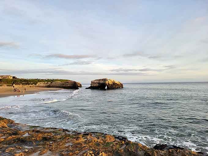 The twin formations stand together at sunset, a reminder that this bridge once had company long ago.