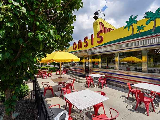 Outdoor seating under cheerful yellow umbrellas offers the perfect spot for enjoying diner classics in the fresh Indiana air.