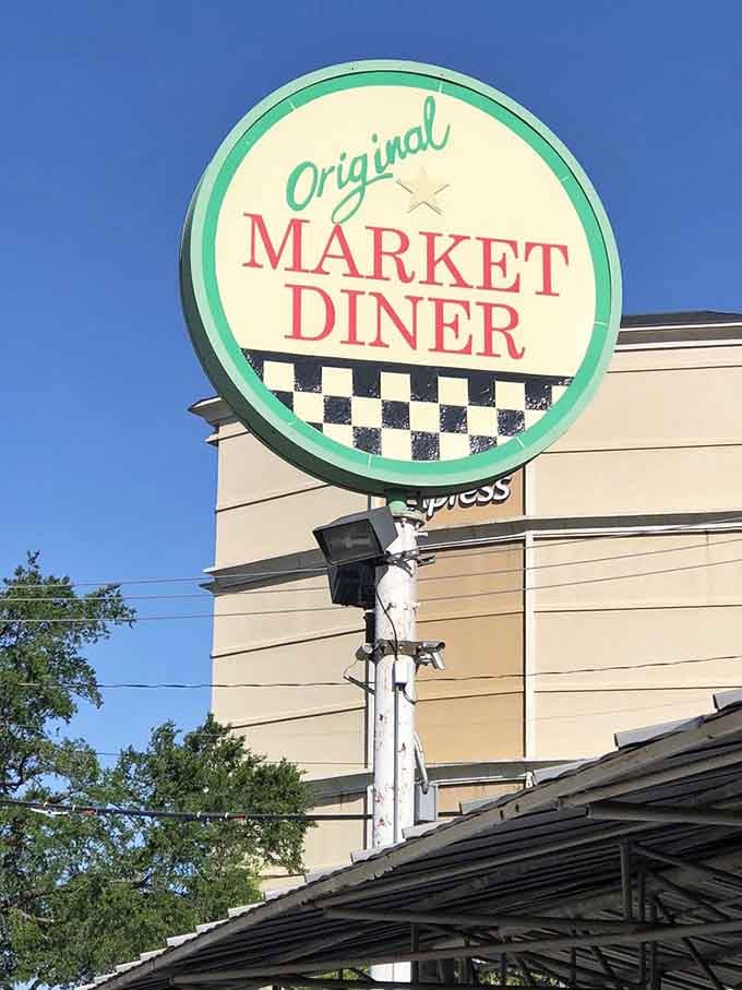 The vintage signage with its checkerboard trim announces your arrival at Dallas's most authentic time-traveling breakfast destination.