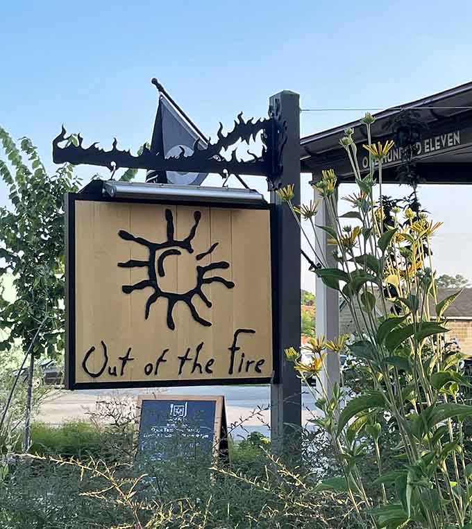 Their distinctive sun logo sign welcomes visitors to this culinary destination where wood-fired cooking reaches artistic heights daily.