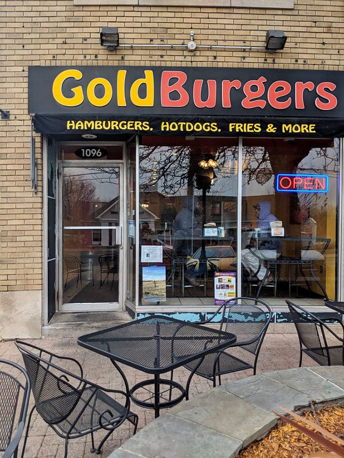 The storefront beckons like an old friend. Those outdoor tables whisper promises of summer evenings and satisfied appetites.