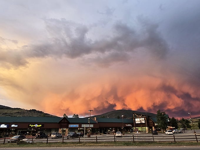 Sunset over the outlets creates drama that no indoor mall could ever match, making even parking lot views Instagram-worthy.