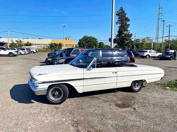 That gleaming white classic convertible isn't just transportation&mdash;it's a rolling invitation to cruise Woodward Avenue with the top down and your troubles behind you.
