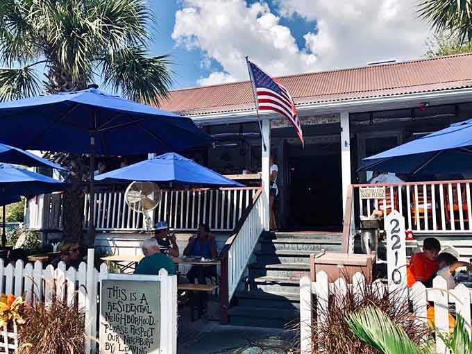 Palm trees and an American flag welcome visitors to this wonderfully weird intersection of literature and lunch.