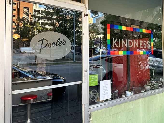 That "Don't Forget Kindness" sign sets the tone before you even taste the legendary food inside.