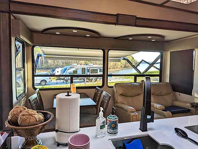 Stone and timber pavilion standing sentinel by the shore. This gathering place has witnessed countless family reunions, picnics, and summer memories.