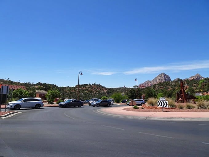 The open road stretching toward red rock majesty, making every commute feel like a vacation.