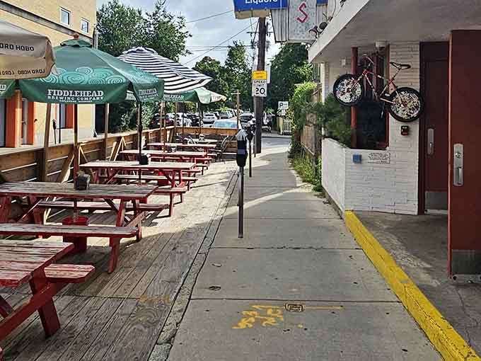 Outdoor picnic tables let you enjoy your barbecue feast while soaking up the Davis Square atmosphere.