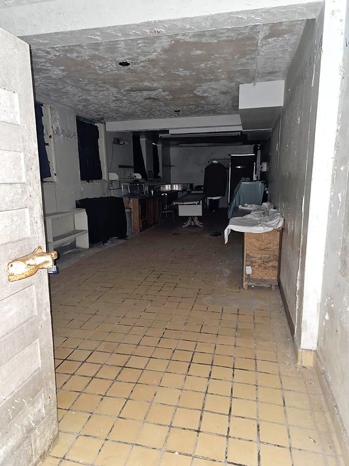 The basement morgue area, with its institutional tiles and stark lighting, remains one of the most actively haunted investigation spots.