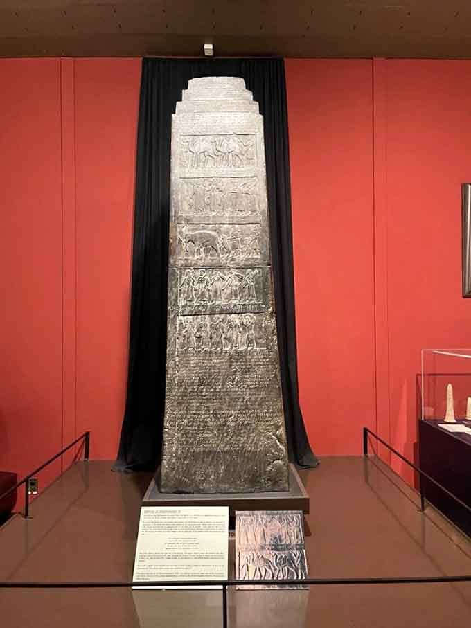 The Black Obelisk towers impressively, covered in ancient stories carved in stone like the world's most permanent Instagram feed.