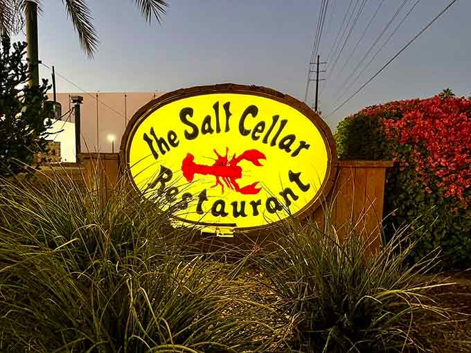 That glowing sign beckons like a lighthouse, guiding hungry souls to their underground seafood salvation in Scottsdale.