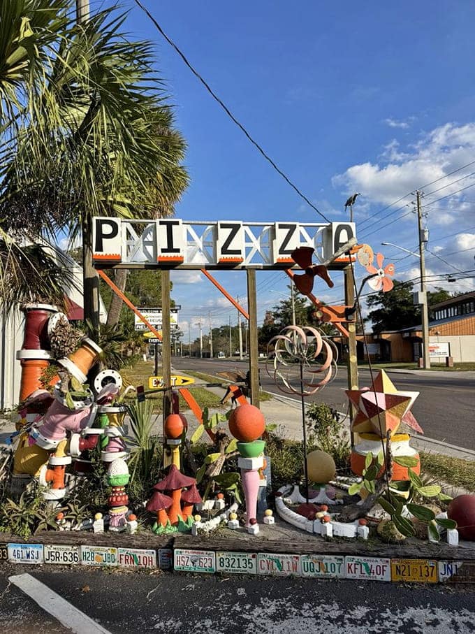 That roadside pizza sign decorated with salvaged treasures announces you've arrived somewhere delightfully different from anywhere else.
