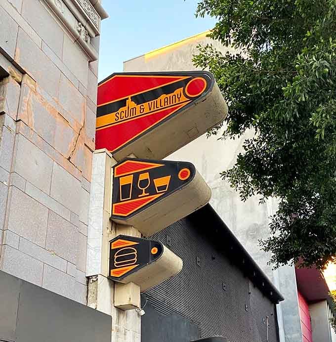 Those retro-futuristic signs outside point the way to drinks, food, and an escape from everyday Earth life.