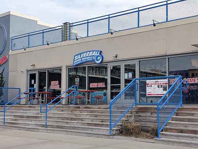 The blue railings lead you up to pinball paradise, where 150 machines await your expert touch.