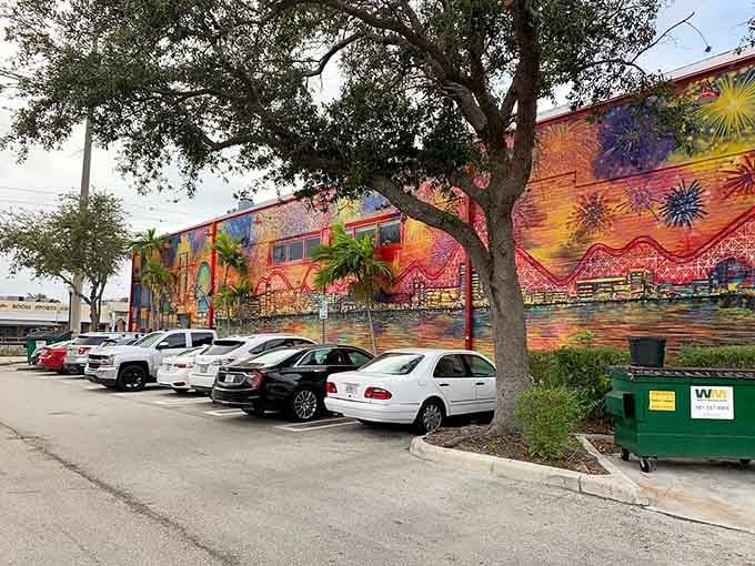 That spectacular exterior mural turning a simple parking lot into an Instagram opportunity and neighborhood landmark simultaneously.