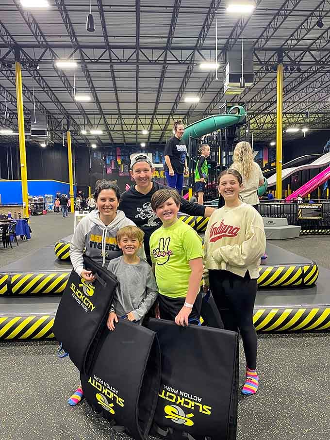 The family that slides together stays together, armed with mats and smiles that'll last all week long.