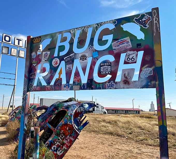 The Bug Ranch sign itself becomes part of the ever-changing art installation, welcoming visitors to automotive creativity heaven.