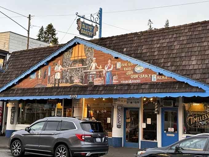The mural above the entrance tells you everything you need to know: tradition, quality, and serious baking happen here.