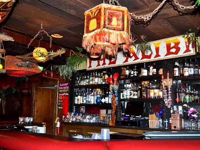 The bar area draped in fringed lamps and tropical decor, where your bartender becomes your new best friend.