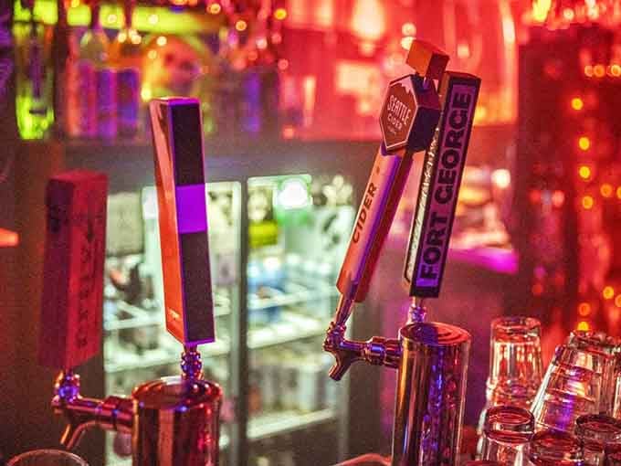 Those tap handles glow against the kaleidoscope of colors, offering libations worthy of this theatrical underground experience.