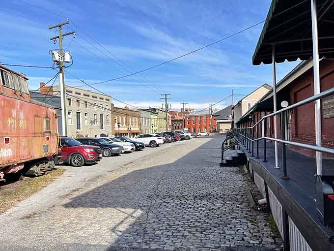 Park between the tracks and town, where cobblestones meet convenience and dinner comes with a side of nostalgia.