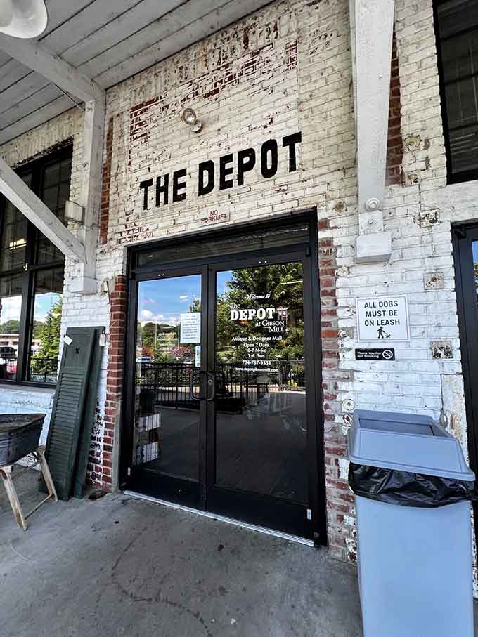 The entrance beckons with painted brick charm, promising adventures in vintage shopping just beyond those glass doors ahead.