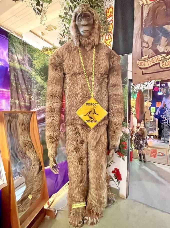 Bigfoot stands tall and proud, wearing his Bigfoot Crossing sign like the fashion statement it absolutely is.