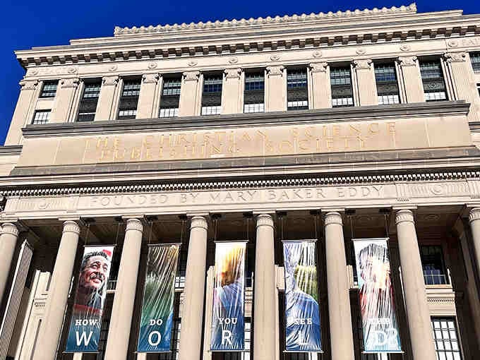 The stately building exterior on Massachusetts Avenue houses this hidden gem, blending seamlessly into Boston's architectural landscape.