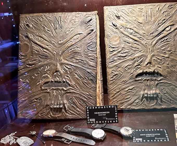 The Necronomicon twins stare back with ancient fury, their leather-bound faces warning visitors to admire but never touch.