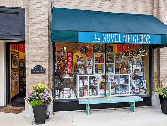 The storefront at dusk with warm lights glowing inside looks like a Norman Rockwell painting come to life.