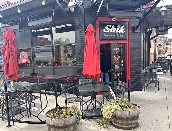 Red umbrellas and black metal furniture create the perfect Pearl Street Mall perch for people-watching while enjoying your meal.