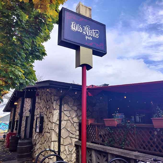 The Old Nick's Pub sign outside The Sparrow & Serpent marks your gateway to culinary adventure ahead.