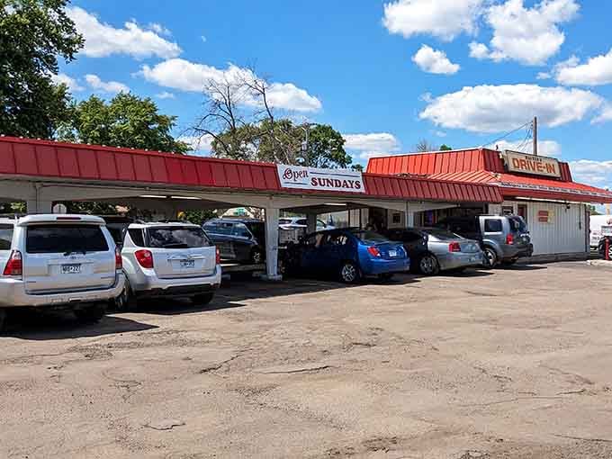 Cars lined up under the canopy like it's 1959, except these vehicles have Bluetooth and way better gas mileage.