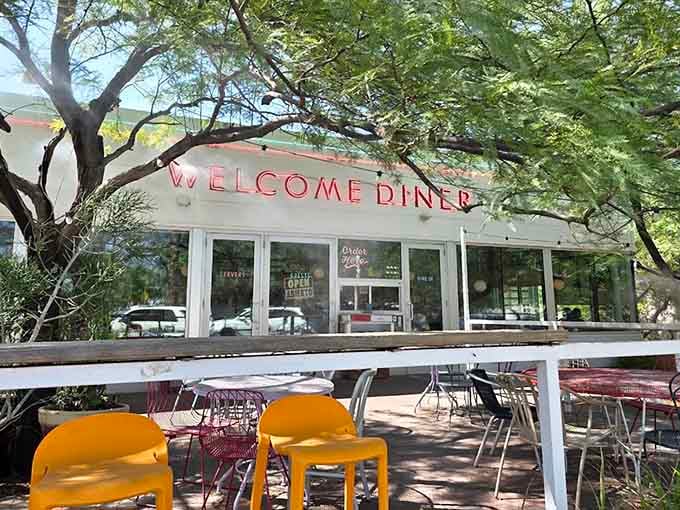 Mismatched chairs and colorful tables make the patio feel like your coolest friend's backyard hangout spot.