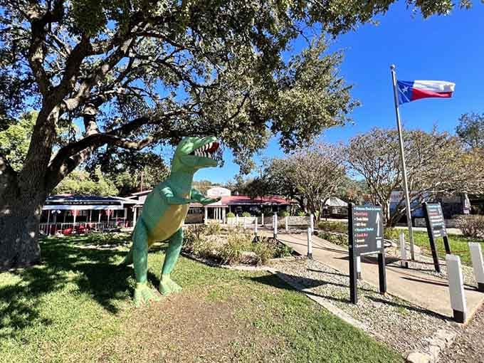 That friendly dinosaur statue greets visitors, reminding everyone that Texas has always known how to do attractions with personality.