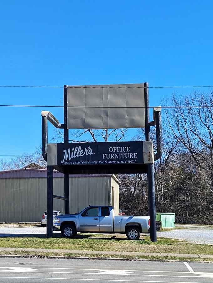Another satisfied visitor discovers that parking under a giant chair is surprisingly more fun than it sounds.