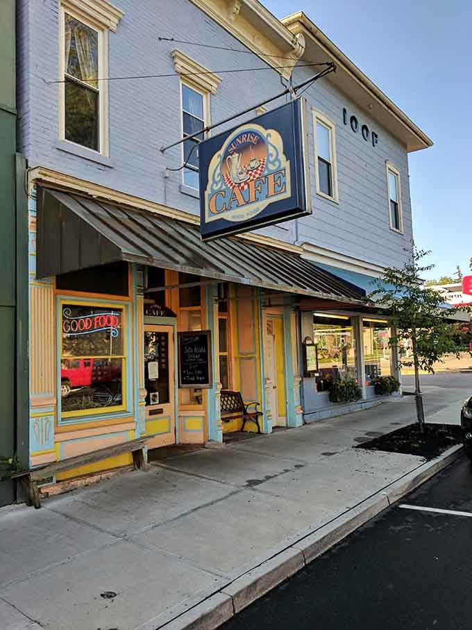 The Sunrise Cafe's colorful facade promises breakfast adventures that'll make you forget about your usual cereal routine.