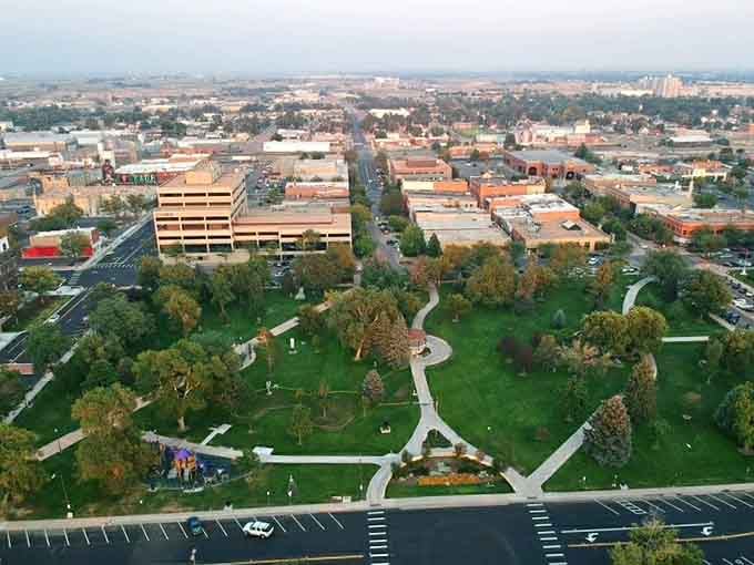 From above, Greeley reveals its thoughtful urban planning—green spaces nestled between buildings like nature's palate cleansers between courses.
