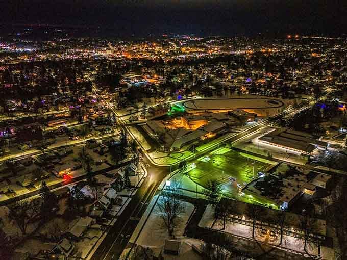 Jamestown transforms into a twinkling wonderland after dark, its grid of streets creating a mesmerizing pattern of lights against the winter landscape.
